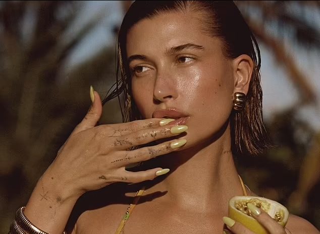 When Hailey Bieber transforms into a mermaid for her brand Rhode, she ...