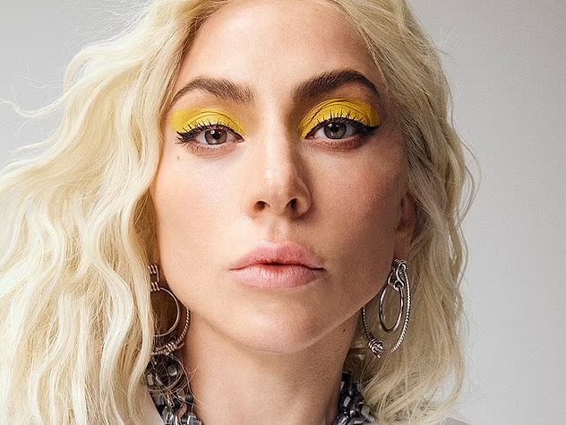 Gaga in a glamorous gray skimpy dress poses for colorful snaps on ...